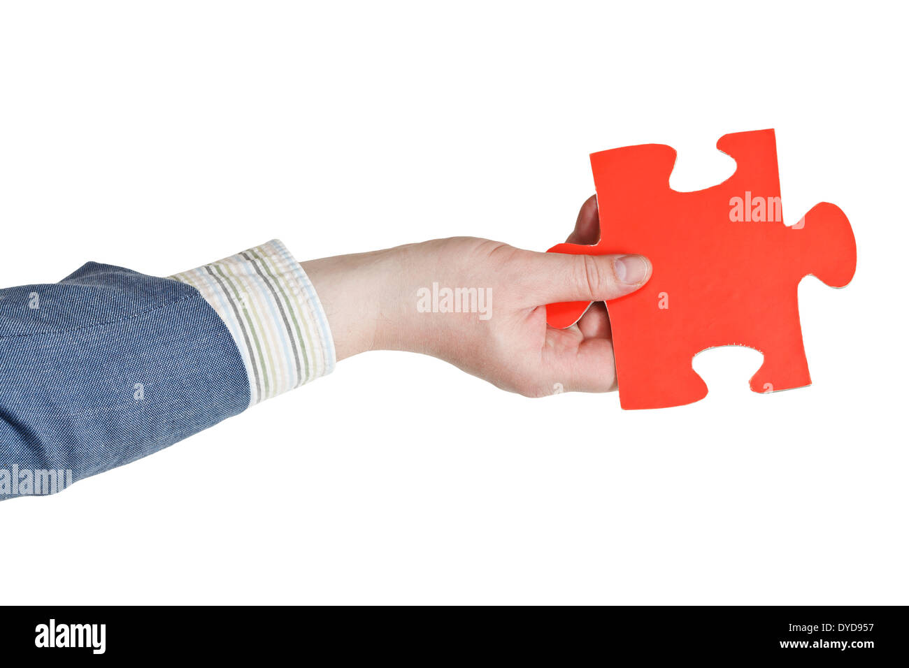 male hand holding big red paper puzzle piece isolated on white ...