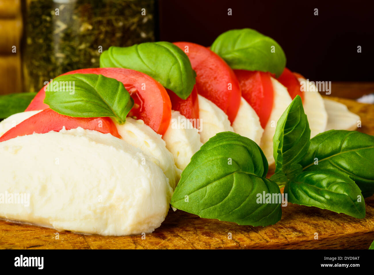 homemade traditional caprese salad with mozzarella cheese, tomatoes and ...