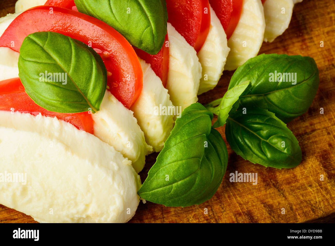 caprese salad with mozzarella cheese, basil and tomatoes Stock Photo ...