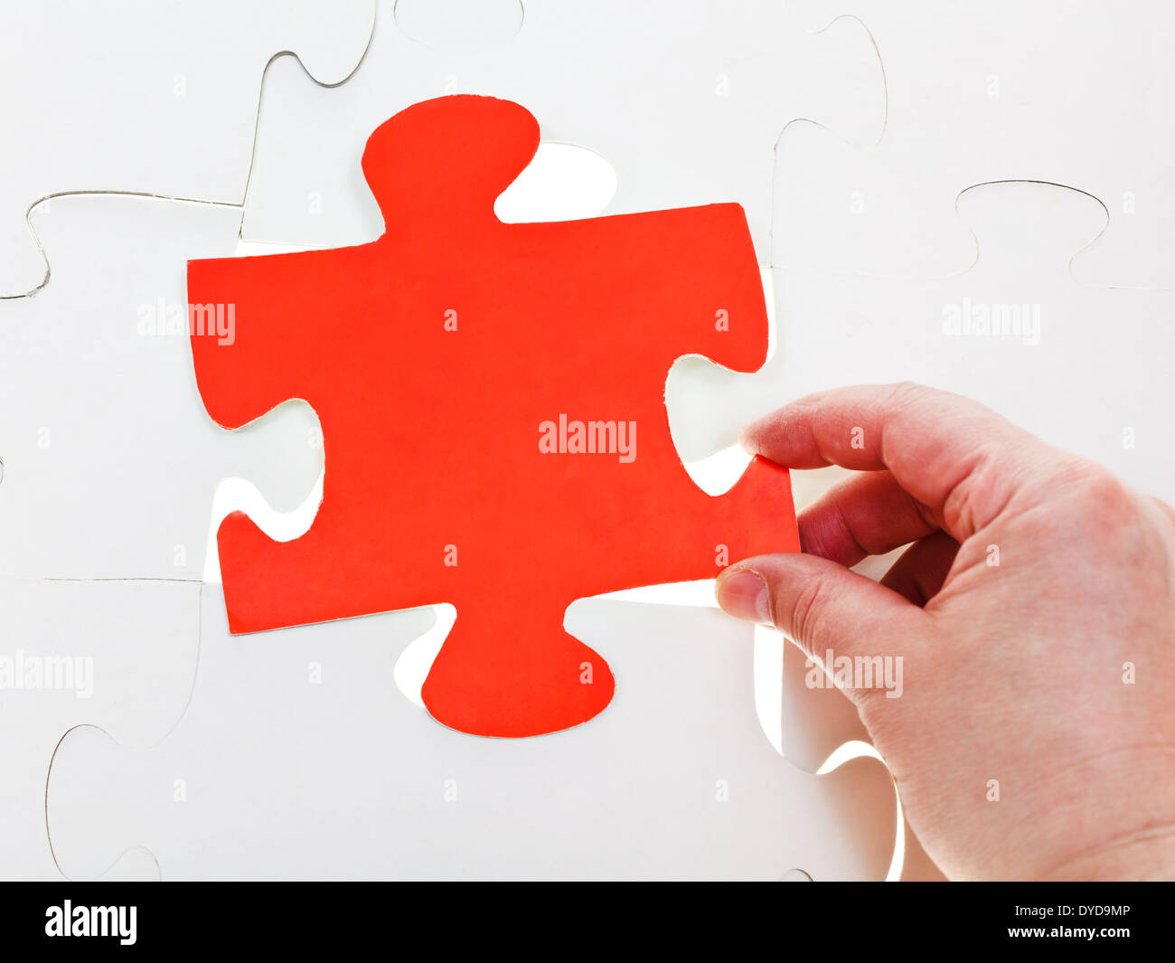 fitting red puzzle piece on free space in layer assembled puzzles Stock ...