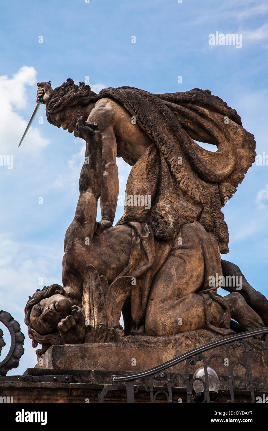 A statue of fighting giants above the entrance gate to the first Castle ...