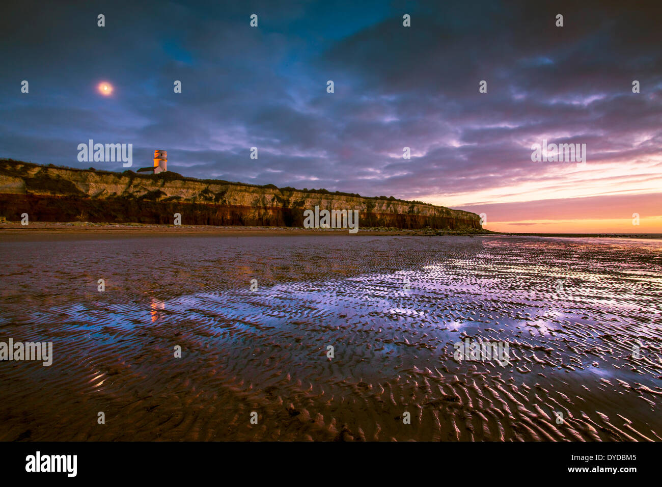 Hunstanton cliffs at twilight with moon Stock Photo - Alamy