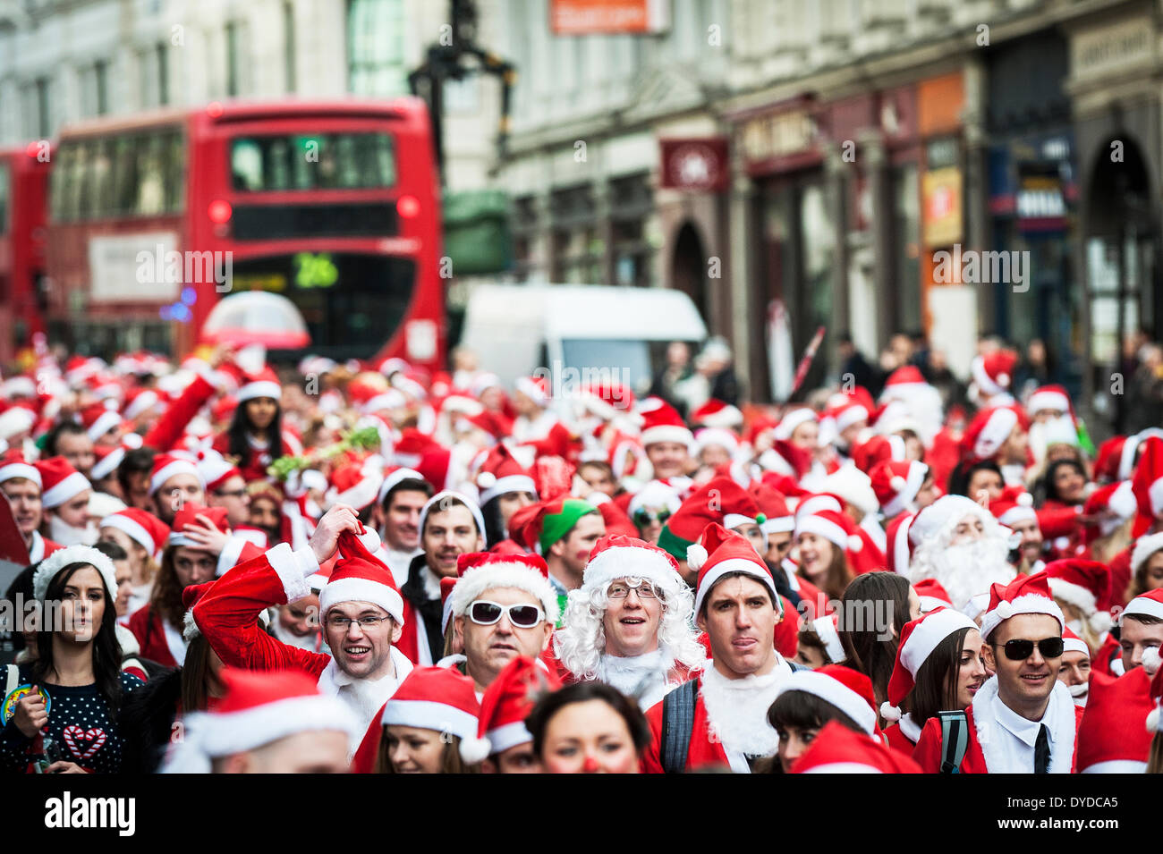 Hundreds of Santas marching through London to celebrate the annual ...