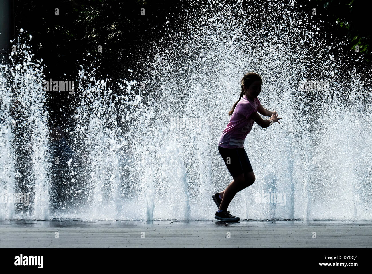 Girl Running Water Fountain High Resolution Stock Photography and ...