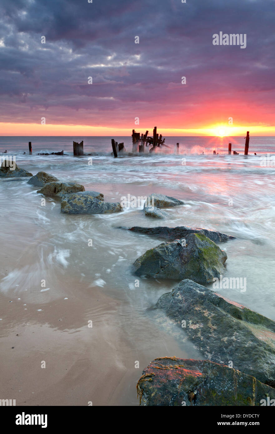 Happisburgh beach and the derelict sea defences at sunrise on the ...
