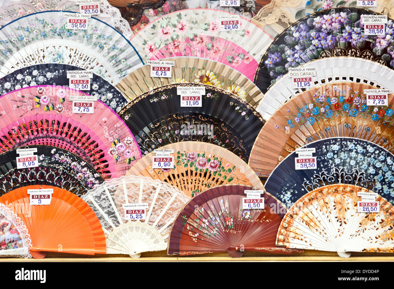 Traditional decorated fans for sale in a shop window Stock Photo - Alamy