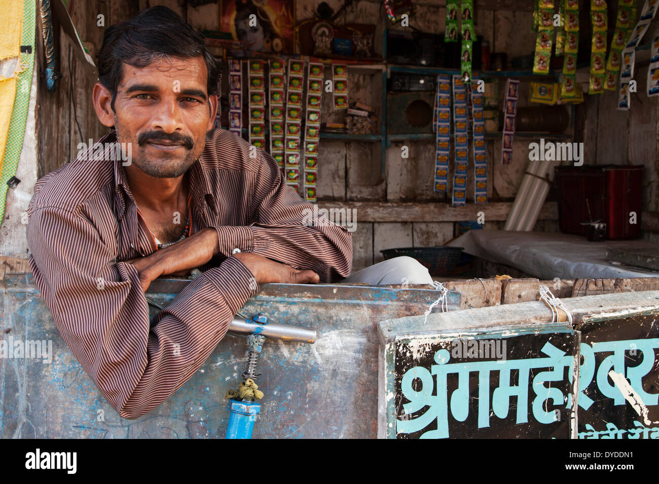 An Indian man in his shop Stock Photo - Alamy