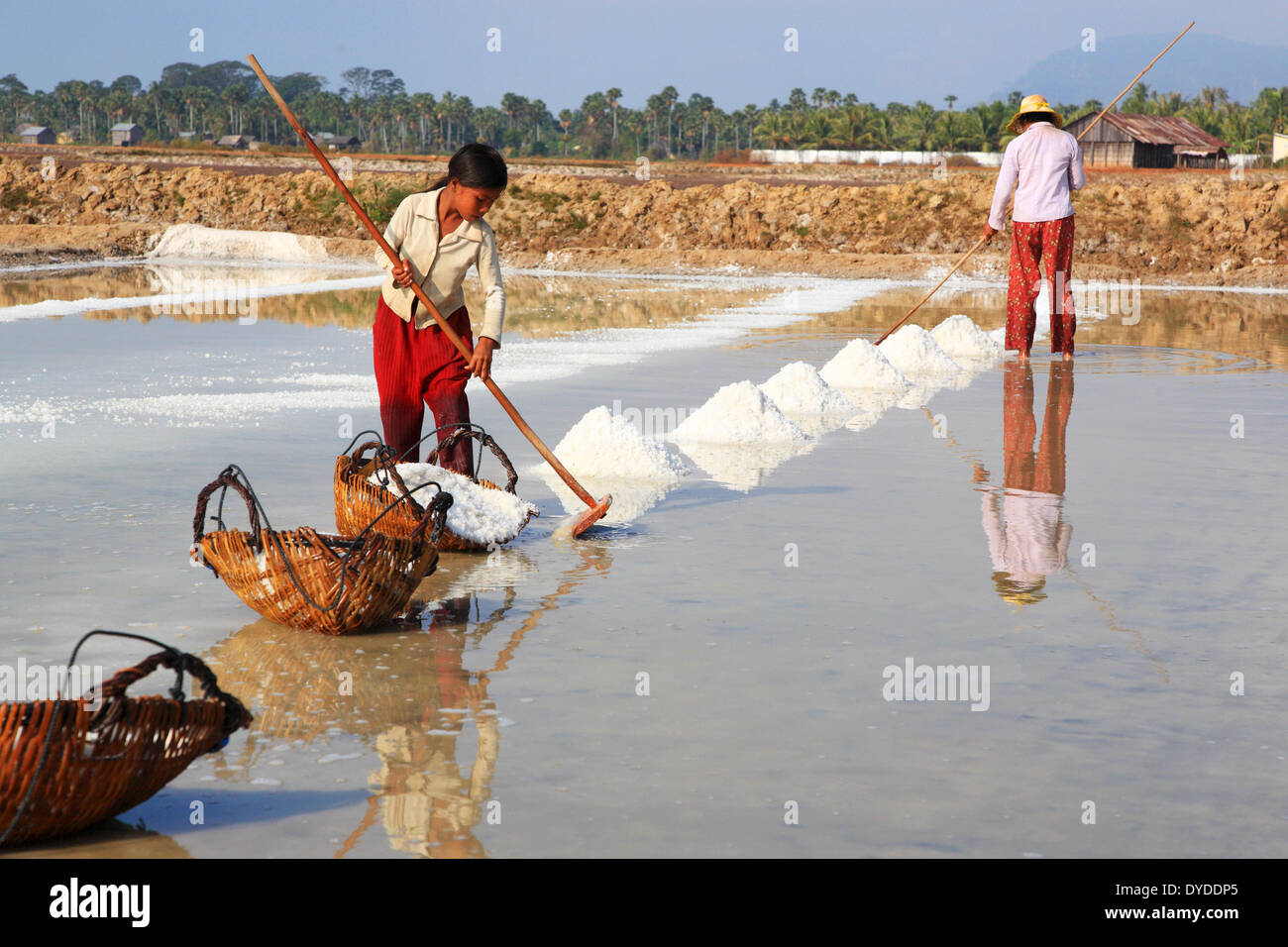 A young girl and her mother extracting salt Stock Photo - Alamy