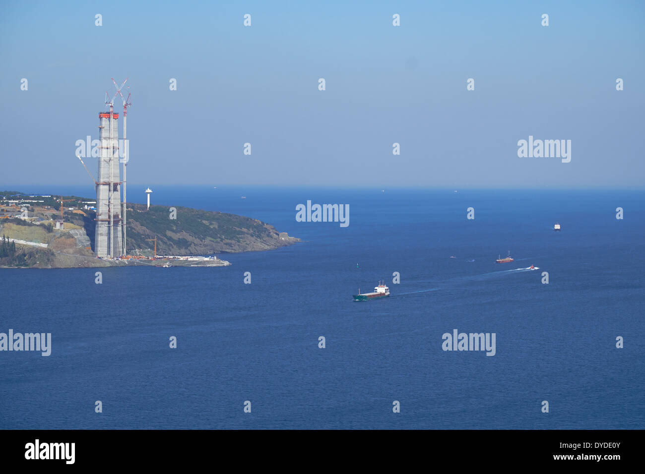 Container ship passing the new Third Bridge that is under construction ...