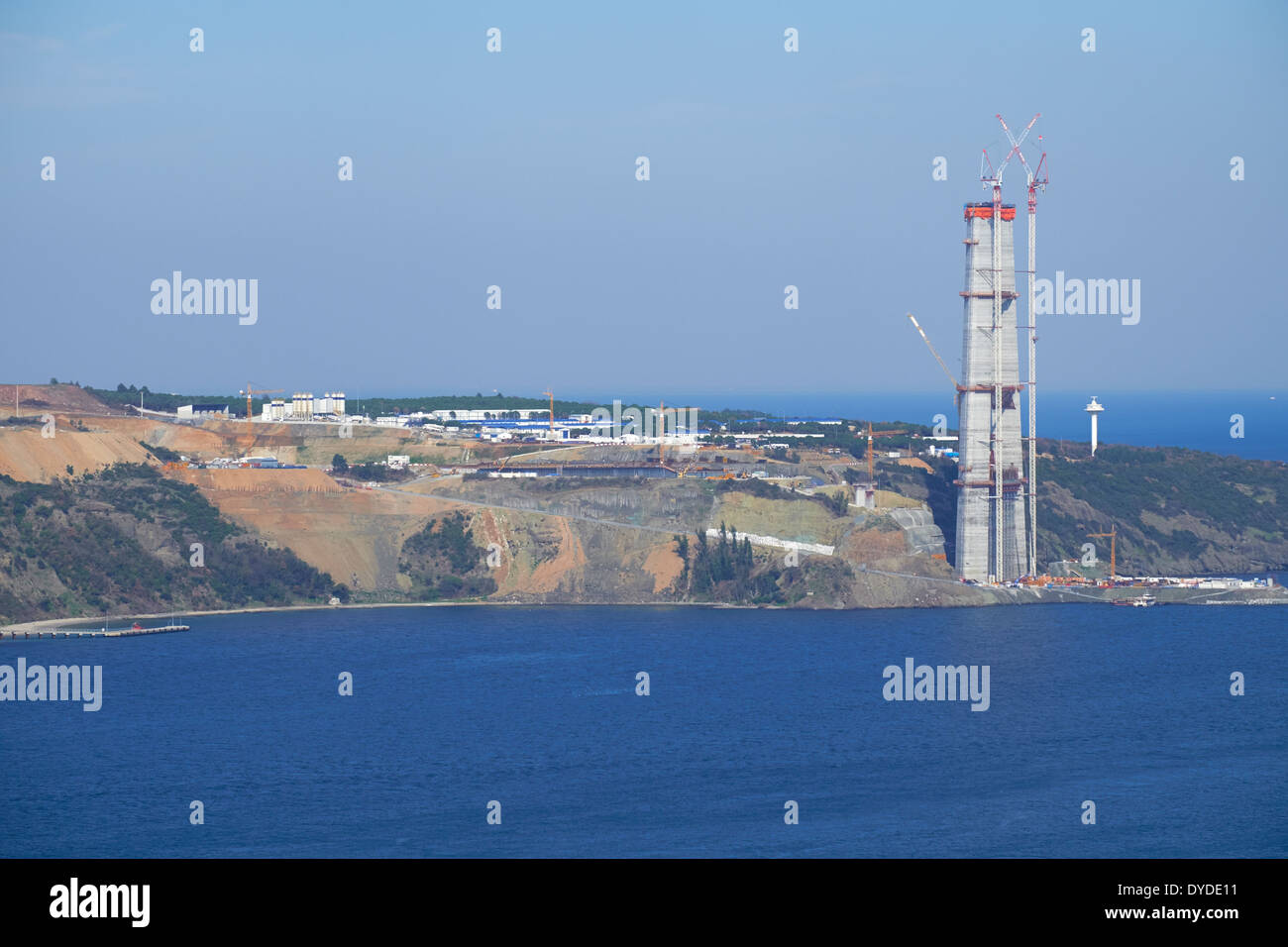 Container ship passing the new Third Bridge that is under construction ...