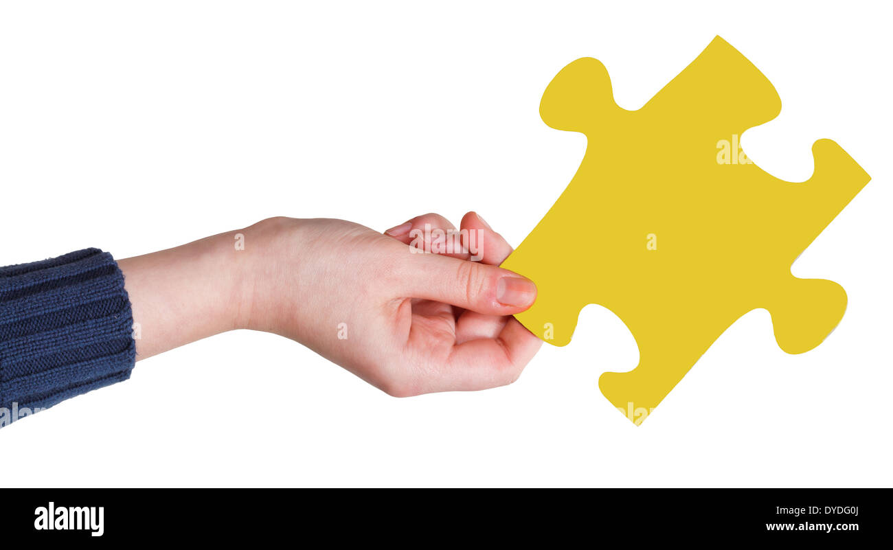 female hand with yellow puzzle piece isolated on white background Stock ...