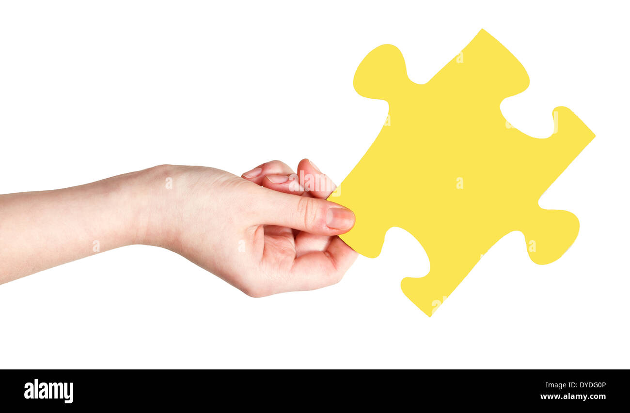 female hand with yellow puzzle piece isolated on white background Stock ...