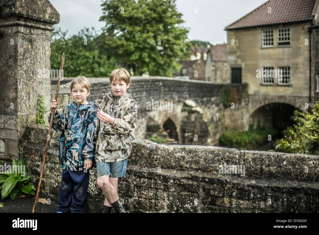 Two brothers stand next to the river Chew at Pensford Bridge in ...