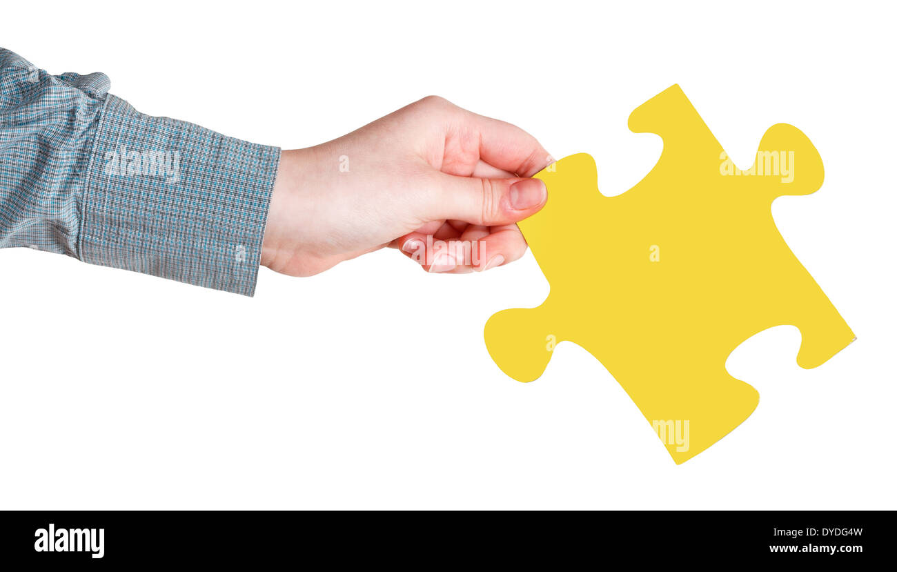 female hand with yellow puzzle piece isolated on white background Stock ...