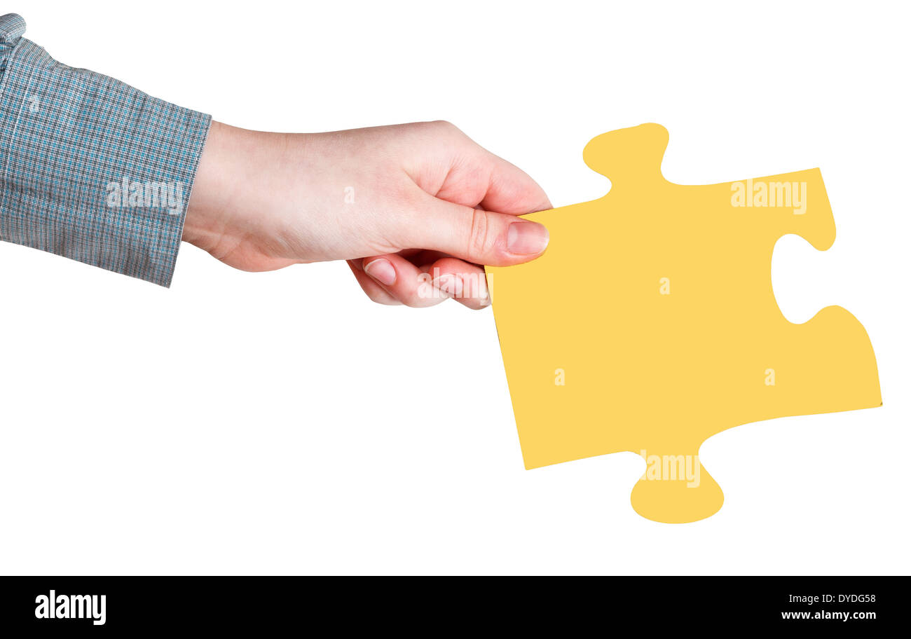 female hand with yellow puzzle piece isolated on white background Stock ...