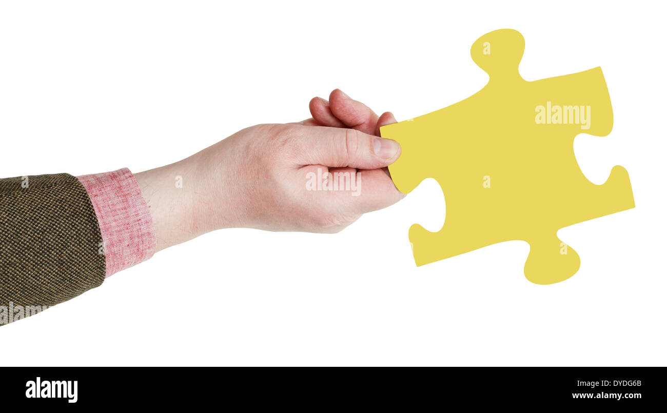 male hand with yellow puzzle piece isolated on white background Stock ...