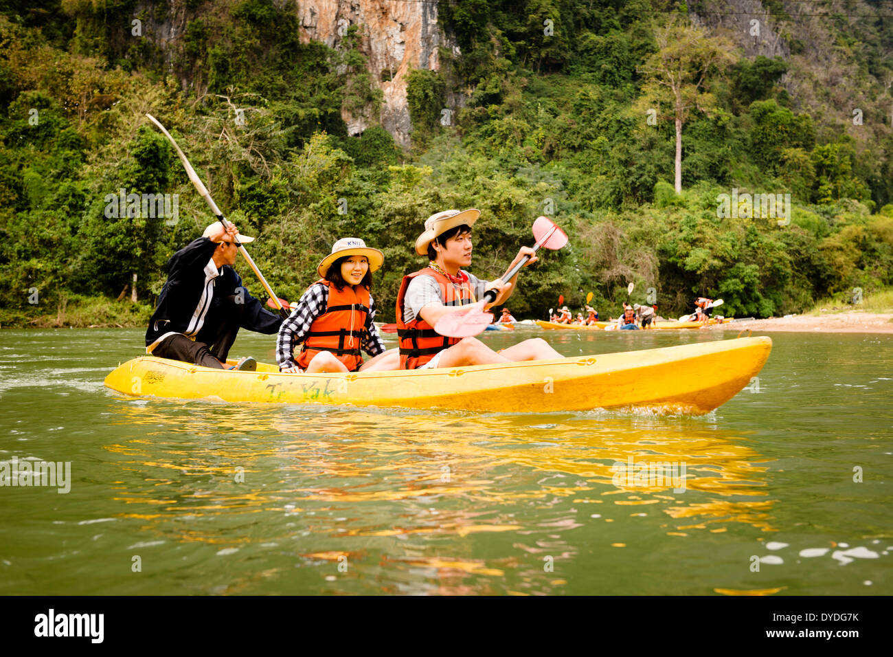 Canoeing on the Nam Song river in Vang Vieng Stock Photo - Alamy