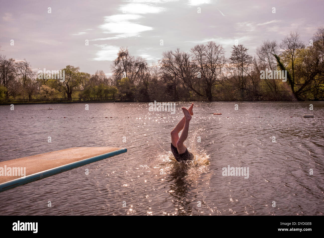 A young man swimming in spring fresh water ponds Stock Photo - Alamy