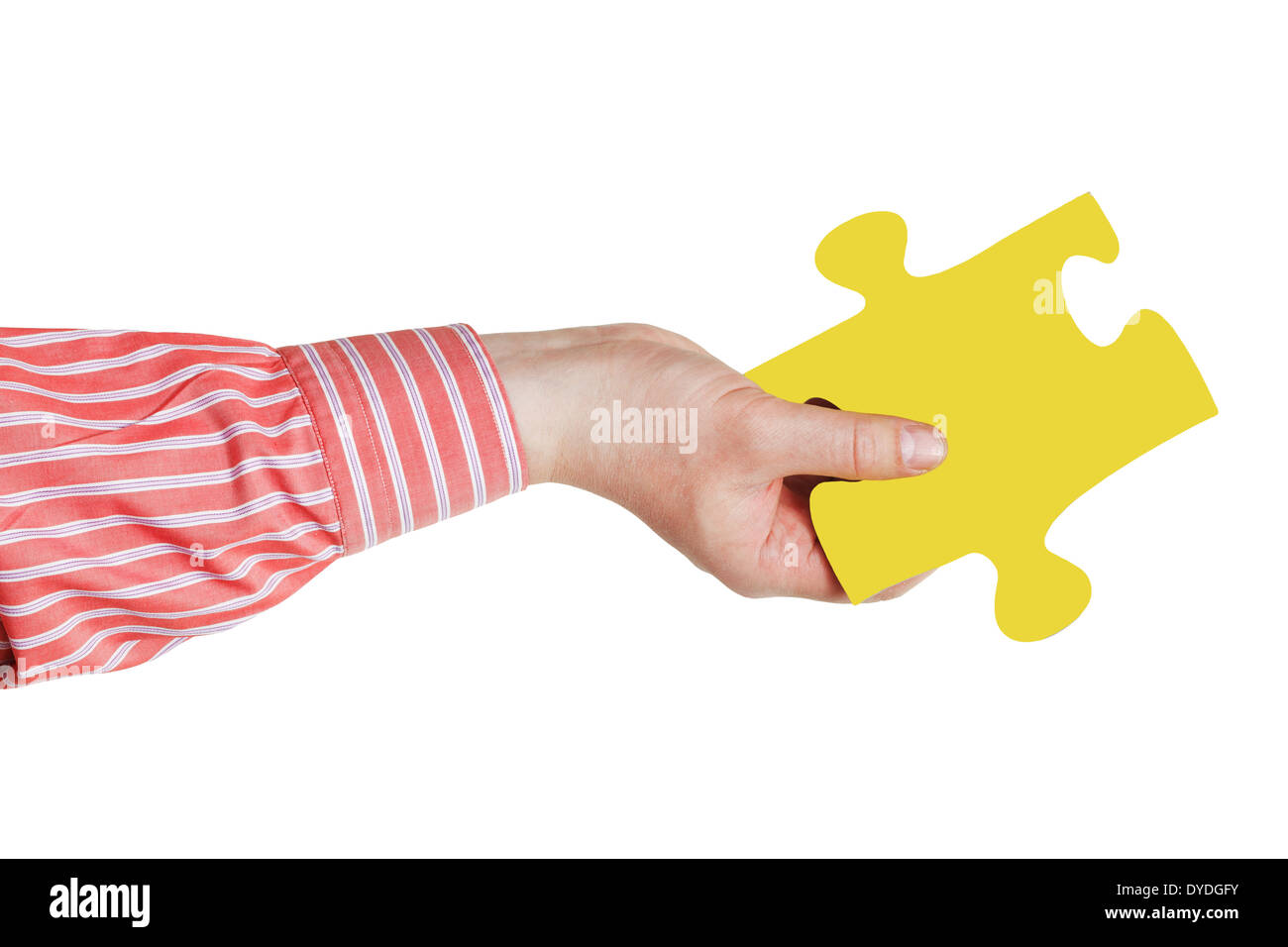 male hand with yellow puzzle piece isolated on white background Stock ...