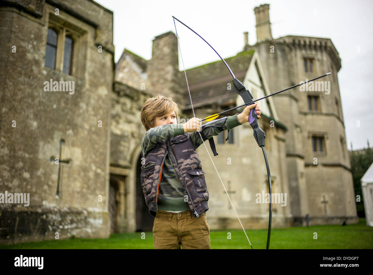 A young boy in Thornbury Castle garden playing archery Stock Photo - Alamy