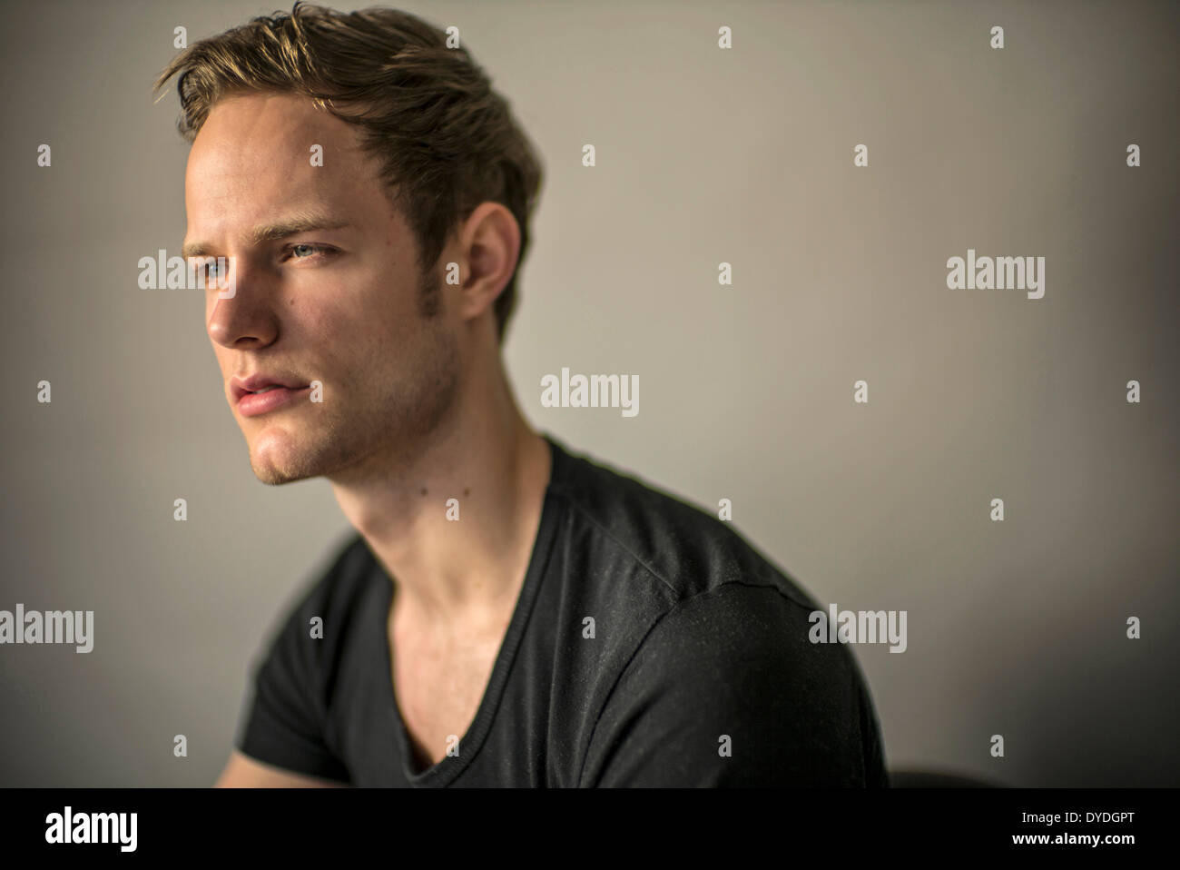 A beautiful young man gazing into the distance Stock Photo - Alamy