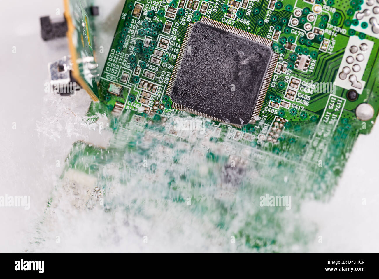 frozen electonics board for computer in ice Stock Photo - Alamy