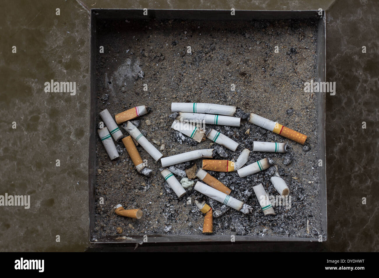 Cigarette ash butt filter in trash Stock Photo - Alamy