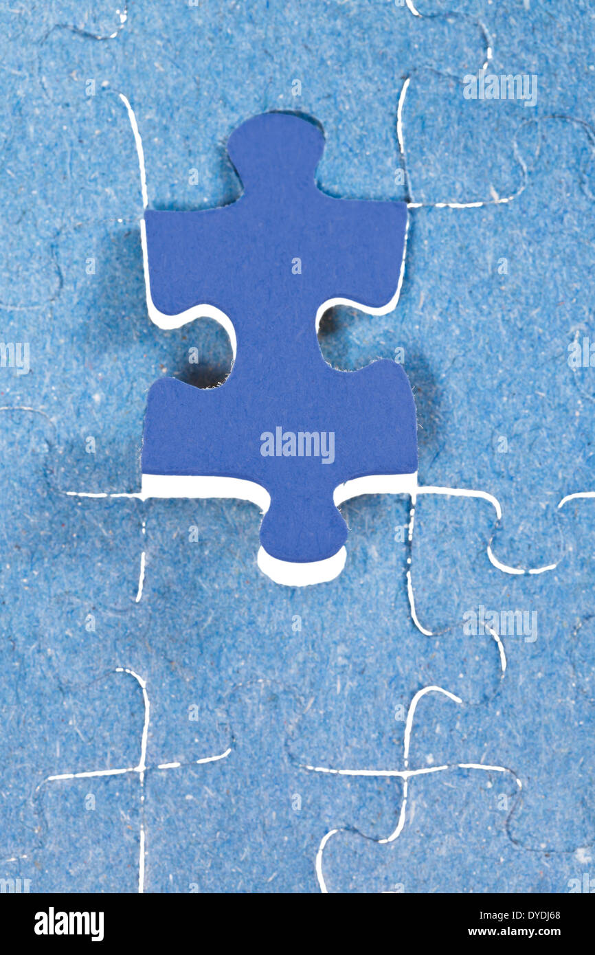 setting the last blue piece of puzzle in free space in assembled jigsaw ...