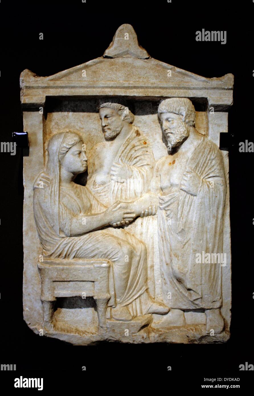 Greek funerary stele carved in marble. Represents a goodbye scene. At ...