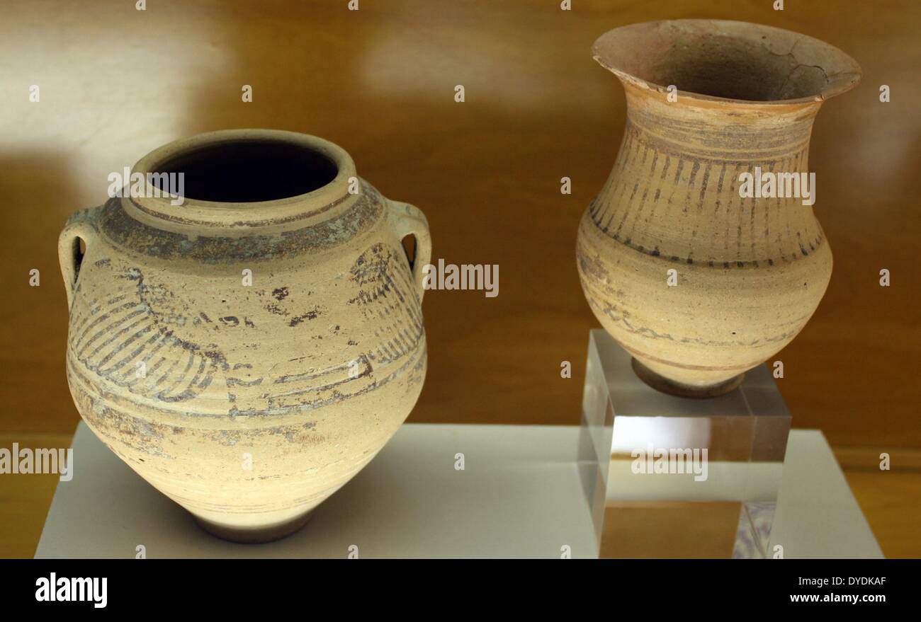 An ancient Greek Urn decorated with geometric a plant and animal ...