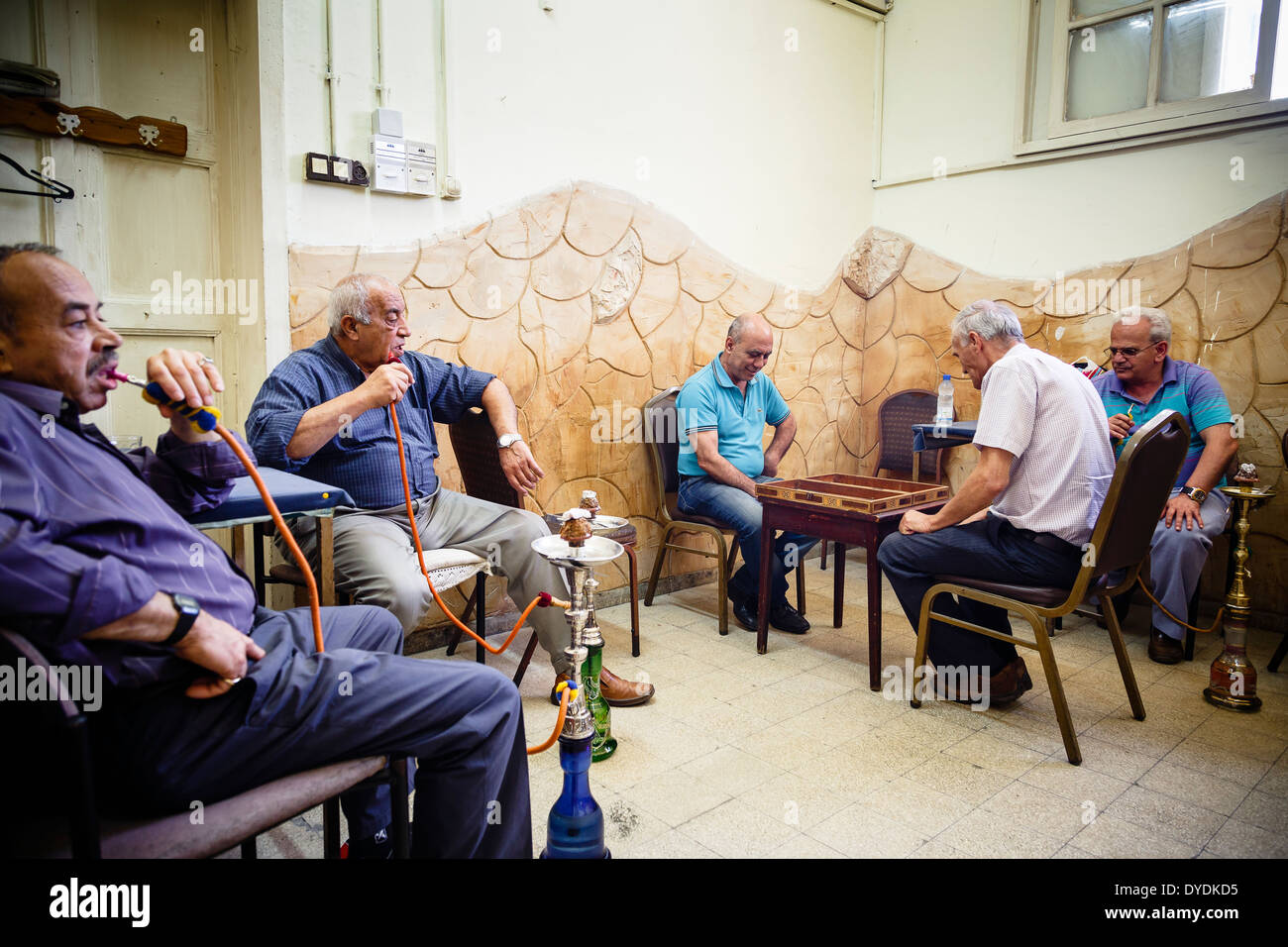 Arab men at a traditional cafe smoking water pipe, Nazareth, lower ...