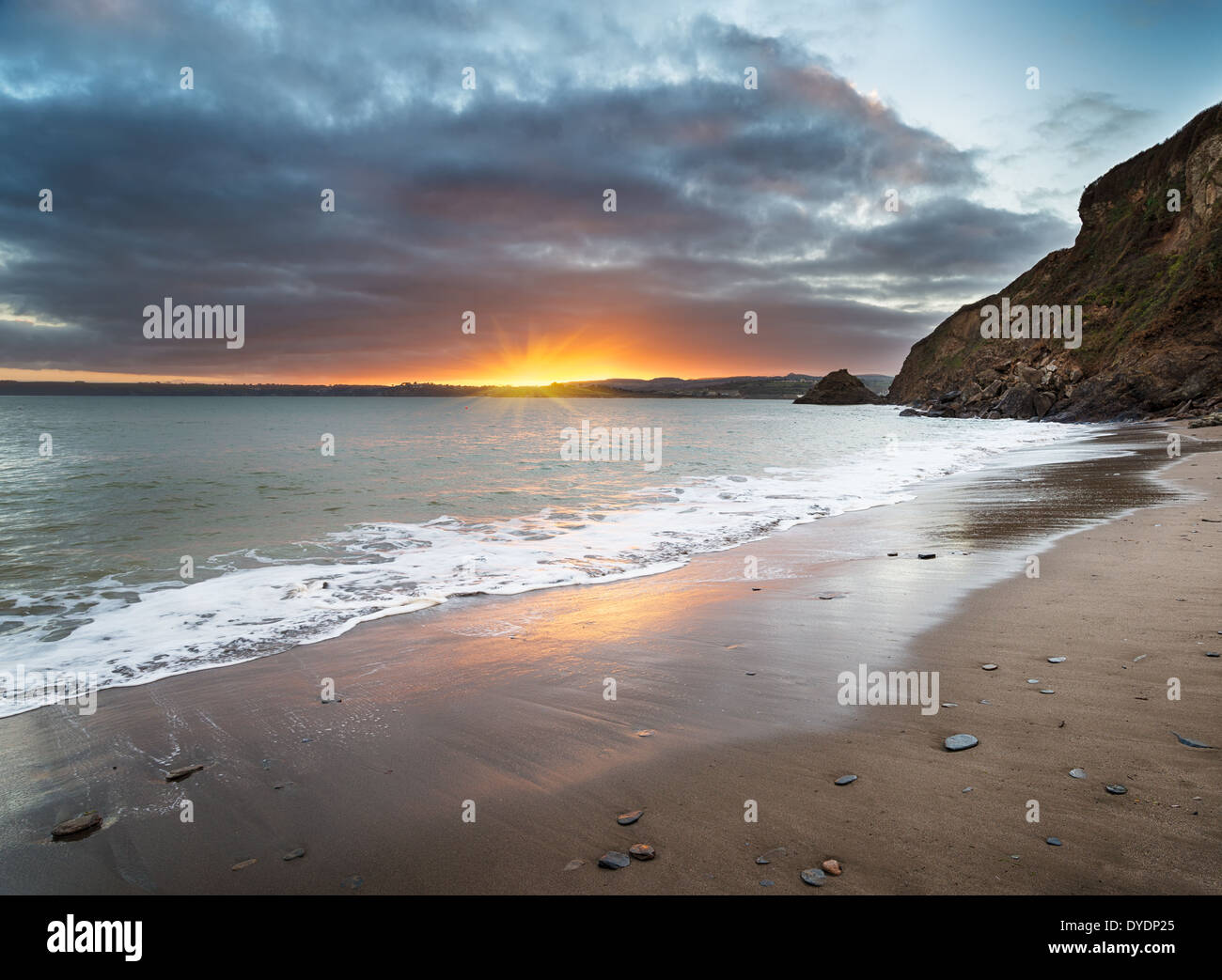 Sunset at Polkerris Beach near St Austel on the south coast of Cornwall ...