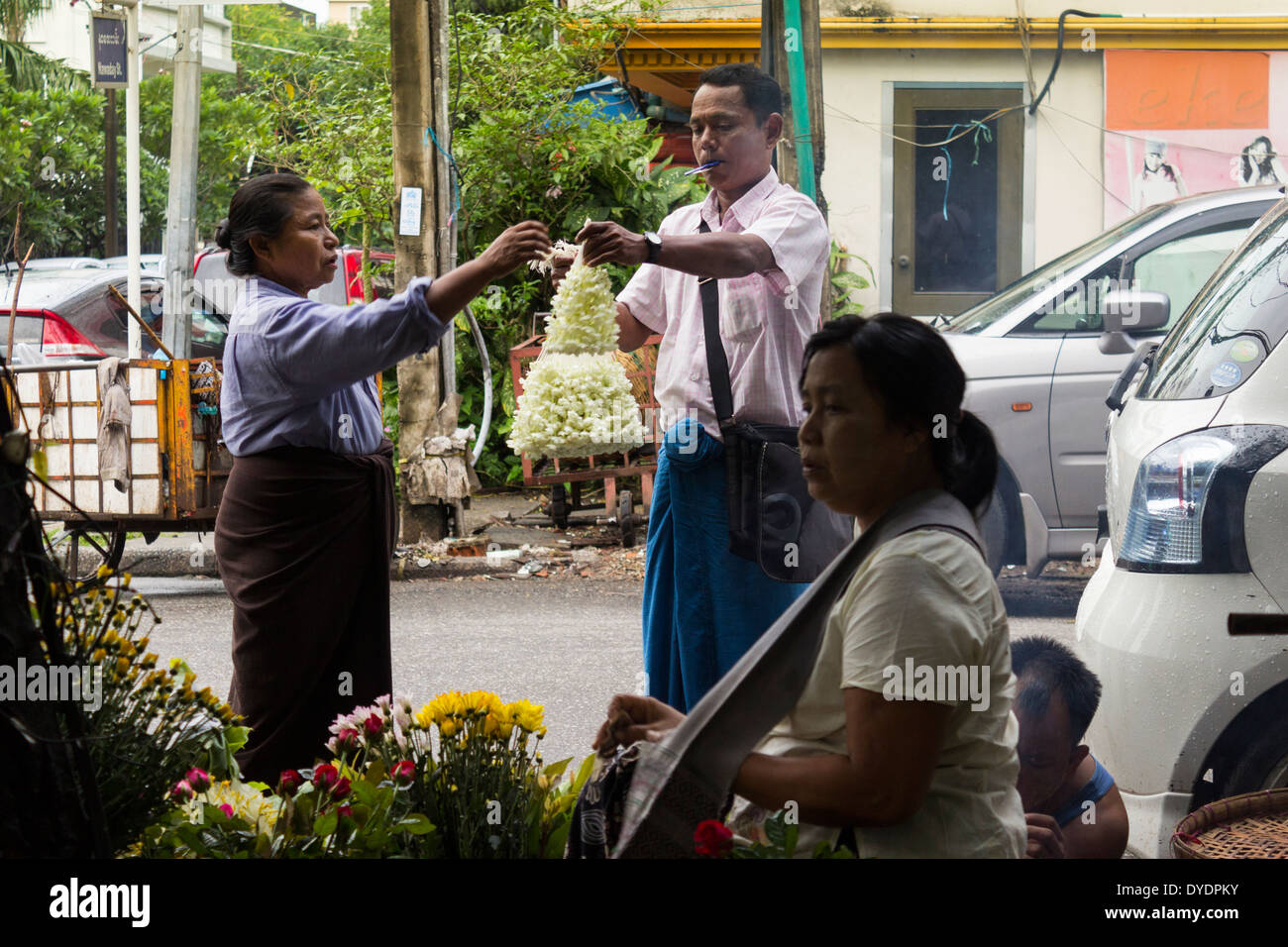 Man street selling flowers hi-res stock photography and images - Alamy