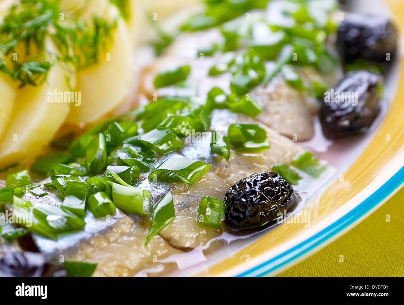 Salted herring with marinated onion and boil potato Stock Photo - Alamy