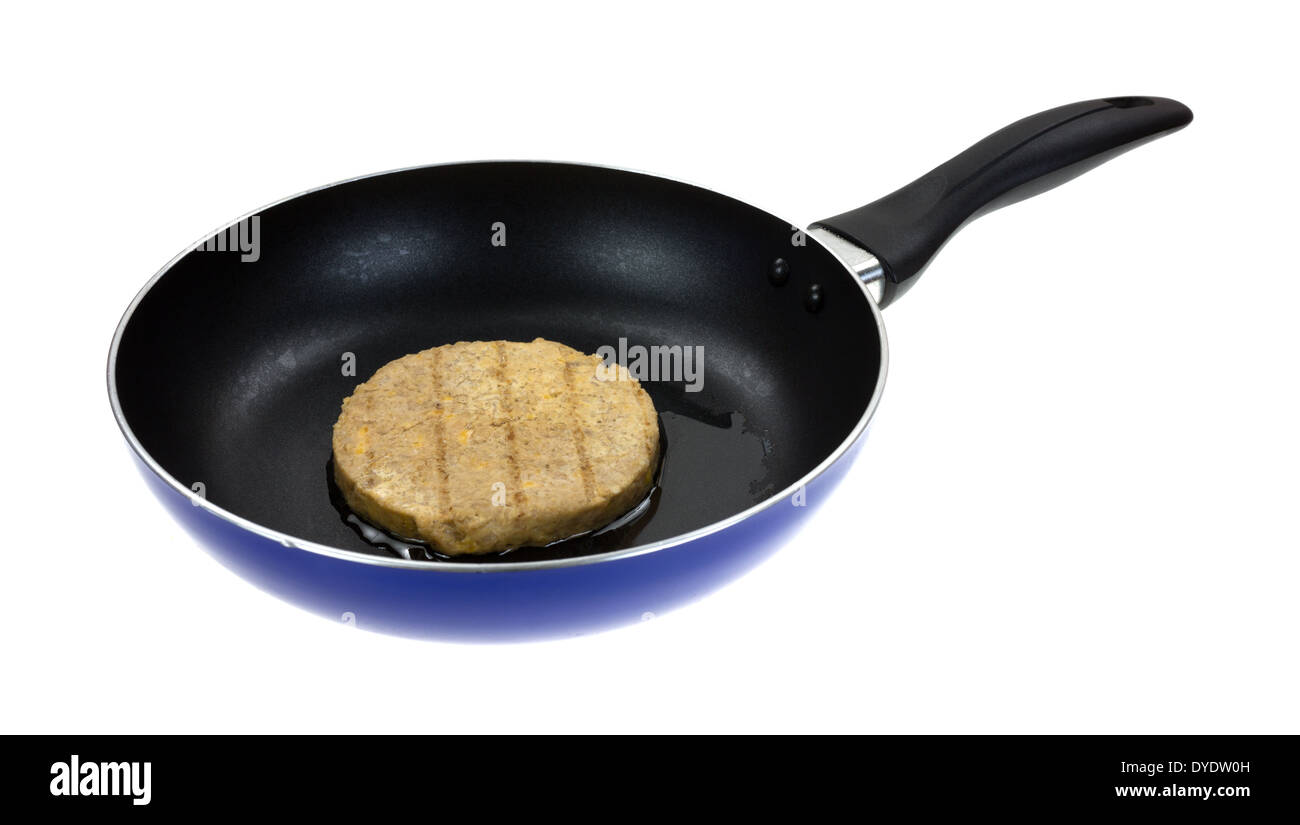 A vegetable burger patty cooking in a small skillet Stock Photo - Alamy