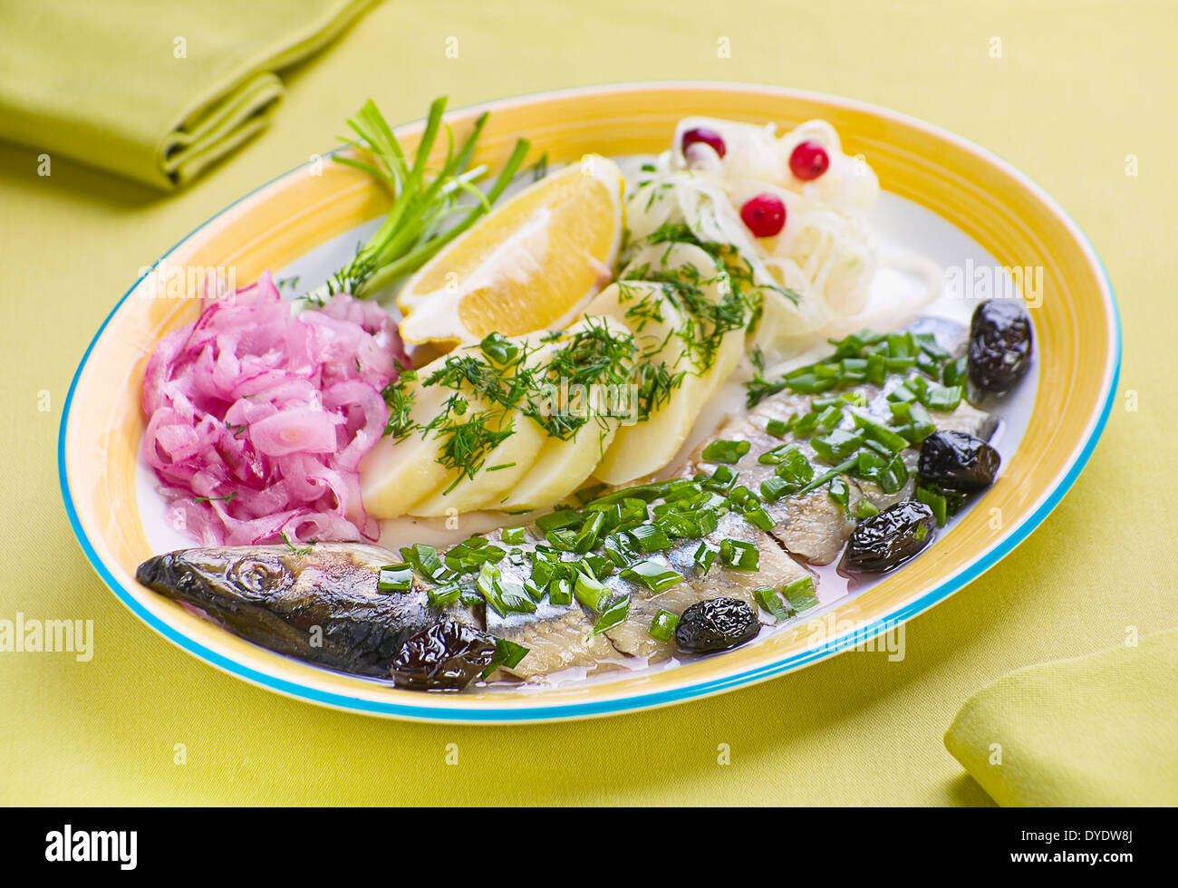 Salted herring with marinated onion and boil potato Stock Photo - Alamy