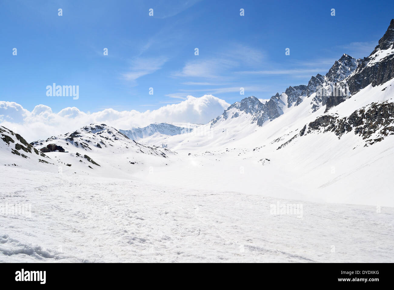 High mountain range in spring with raising clouds from below. Italian ...
