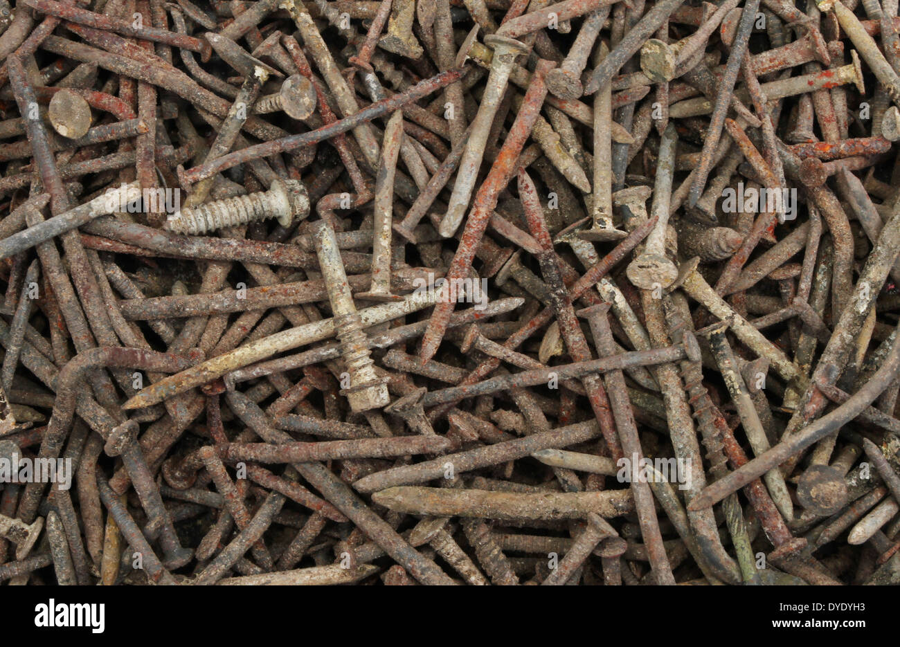 Old rusty nails and screws as a background and texture Stock Photo - Alamy