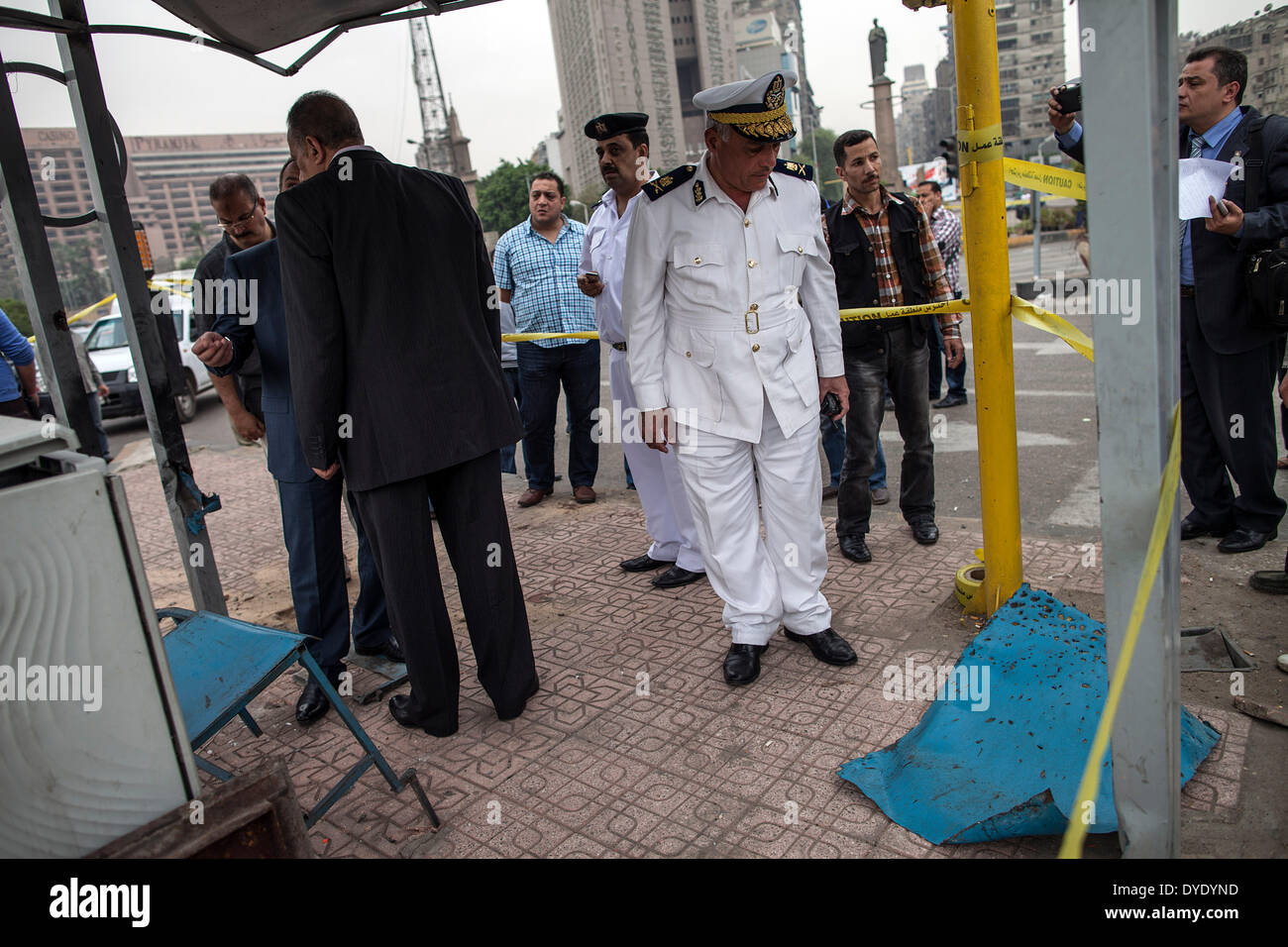 Cairo, Egypt. 15th Apr, 2014. Egyptian policemen inspect the site of a ...