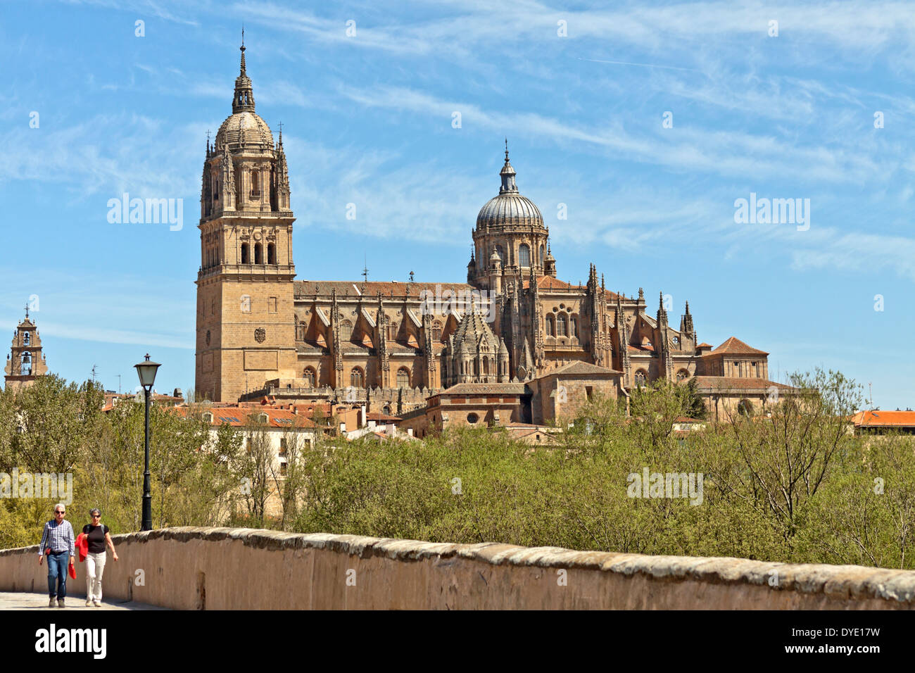 People strolling on Puente Romano a.k.a. the old Roman bridge with view ...