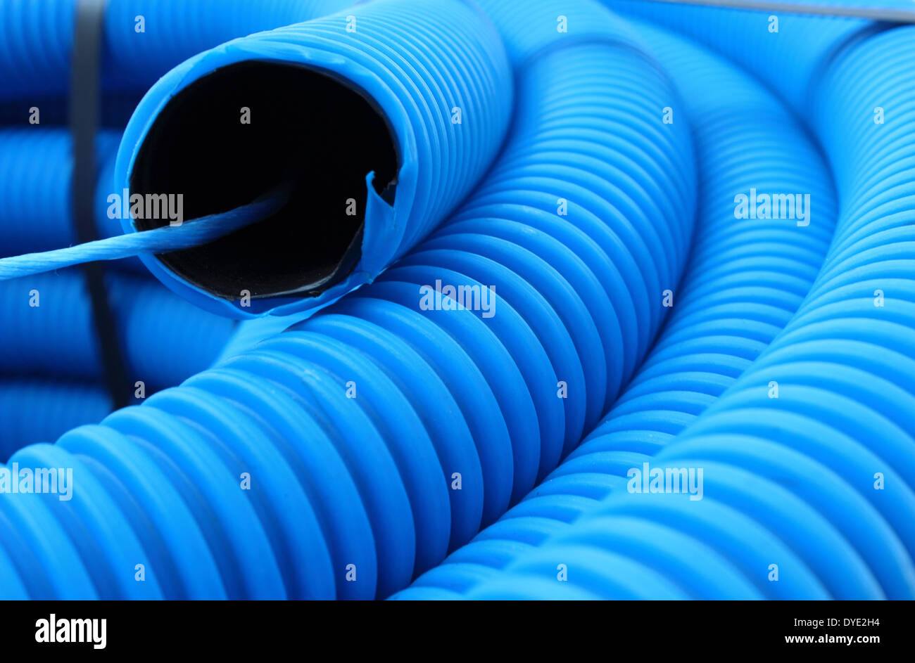 Blue plastic corrugated pipe Stock Photo - Alamy