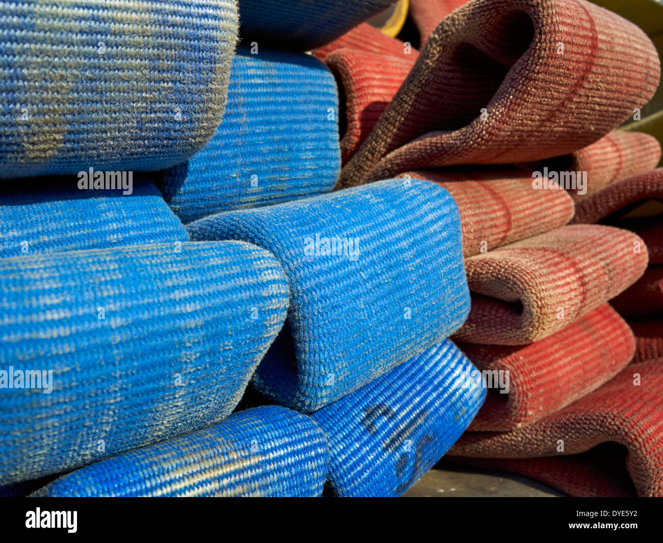 blue and orange fire hoses coiled on a firetruck Stock Photo - Alamy