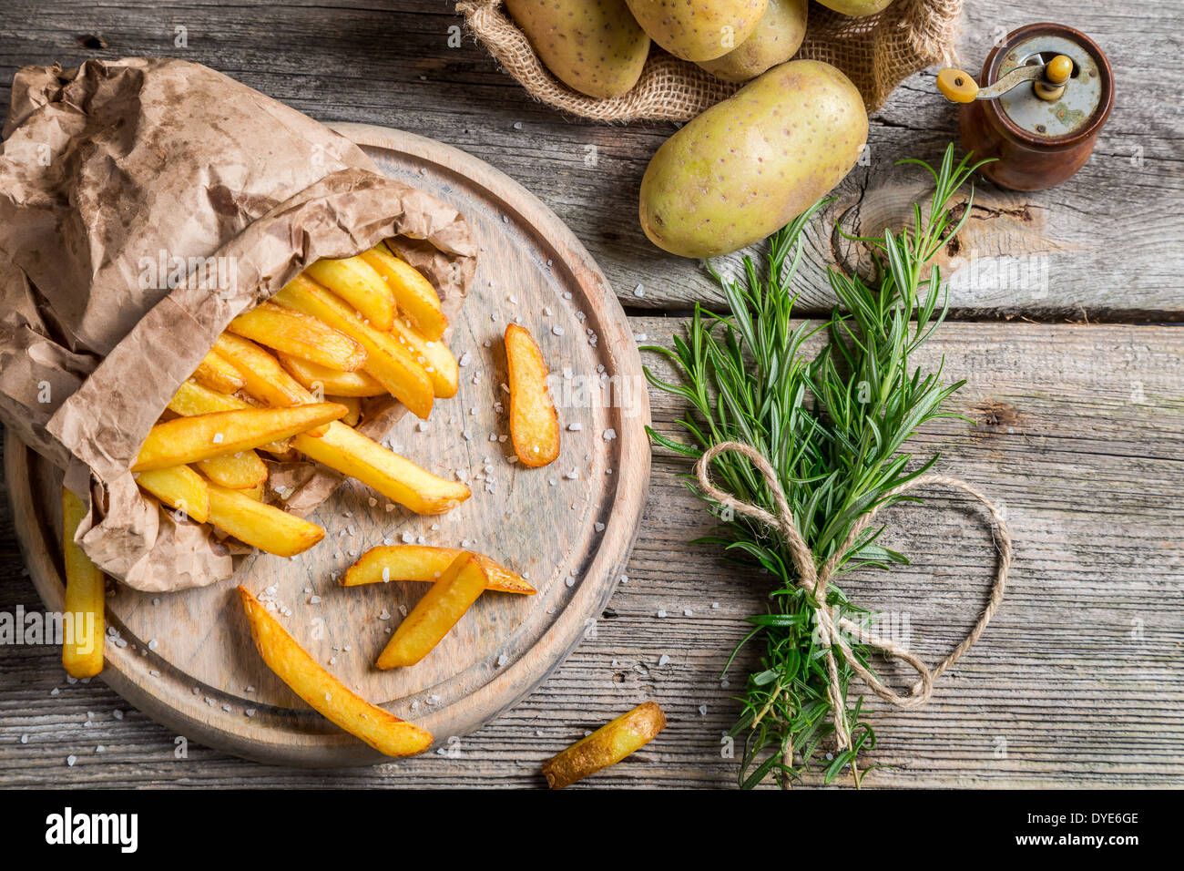 Homemade fries with salt served in paper Stock Photo - Alamy