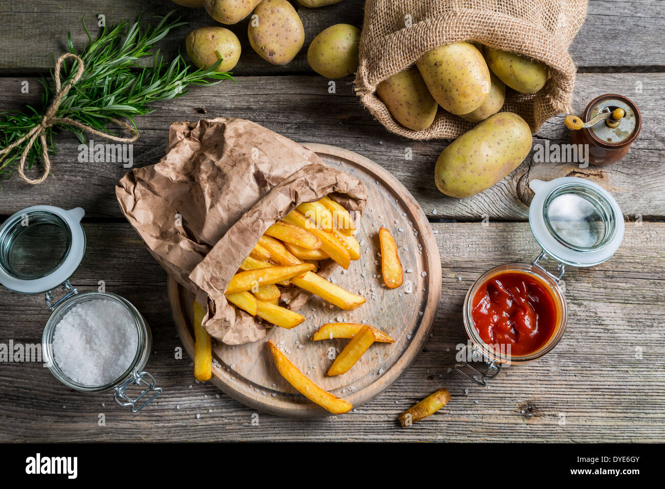 Homemade fries served in paper Stock Photo - Alamy