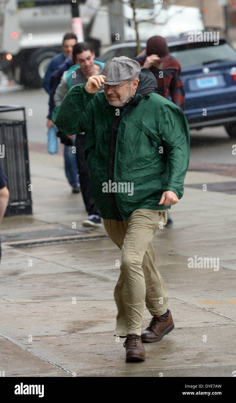 Boston, USA. 15th Apr, 2014. A man walks against strong wind and rain ...