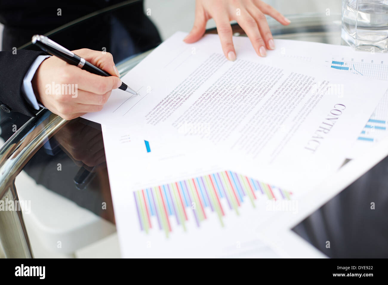 Image of female hand signing document at workplace Stock Photo - Alamy