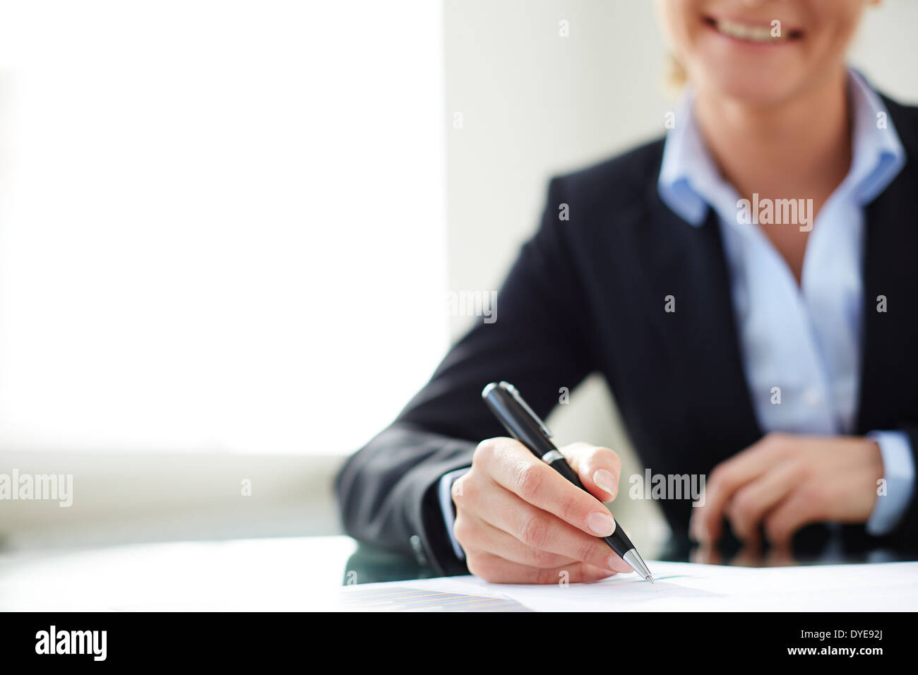 Image of female hand signing document at workplace Stock Photo - Alamy
