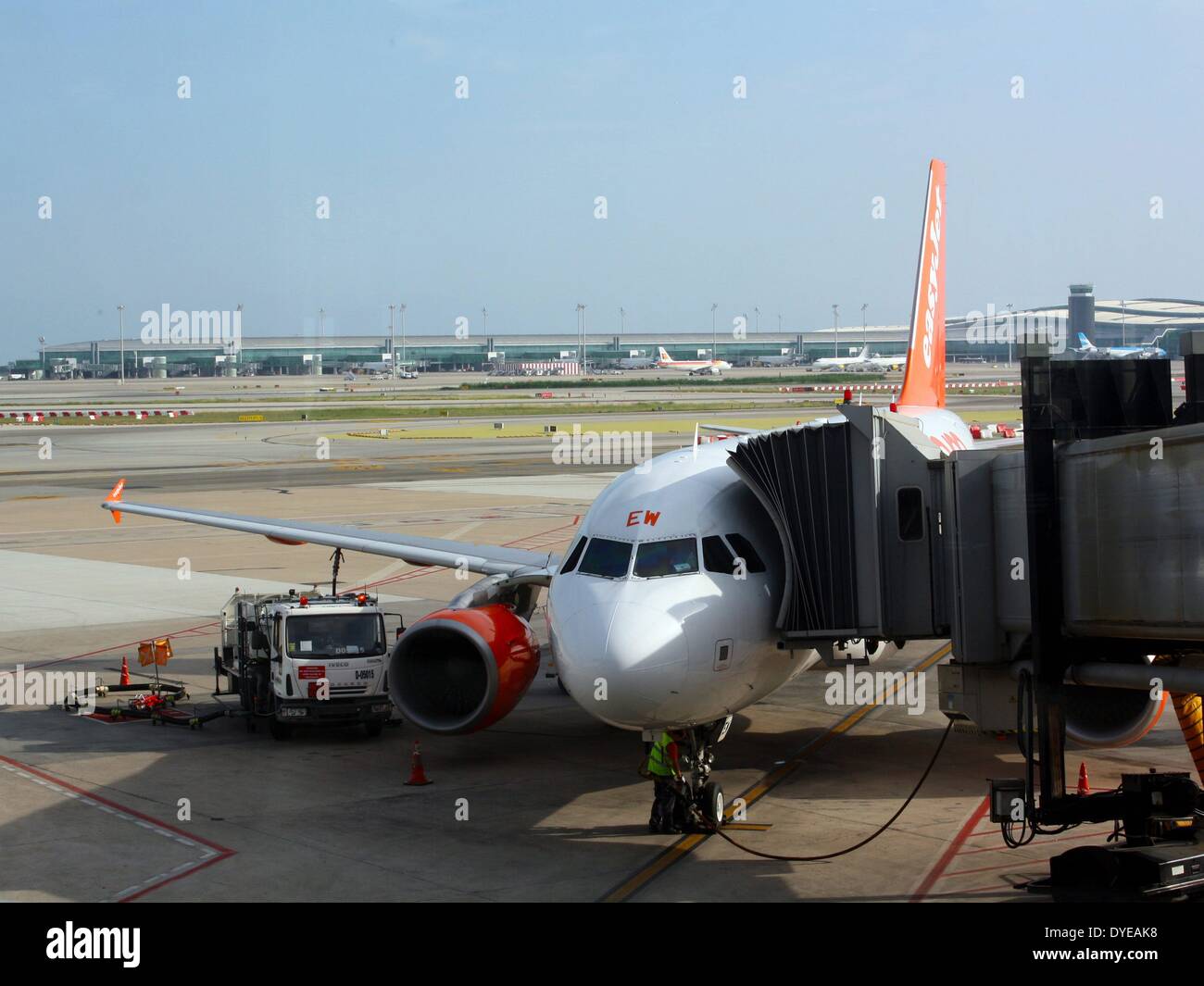 Easy Jet aeroplane boarding passengers on a runway at Barcelona Airport ...