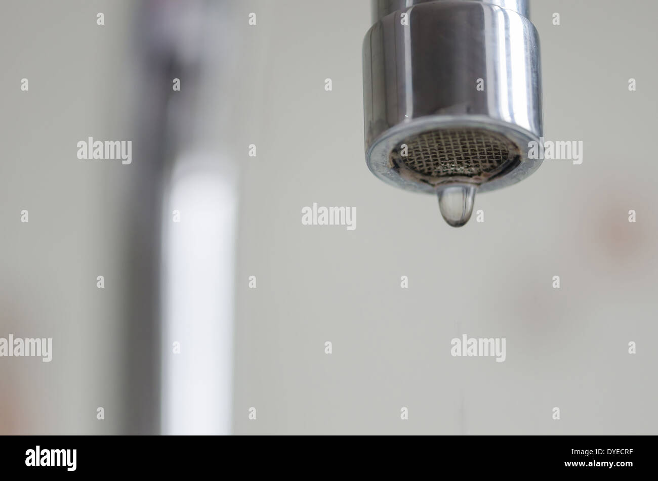 A close-up of a tap with dripping water on a white background Stock ...