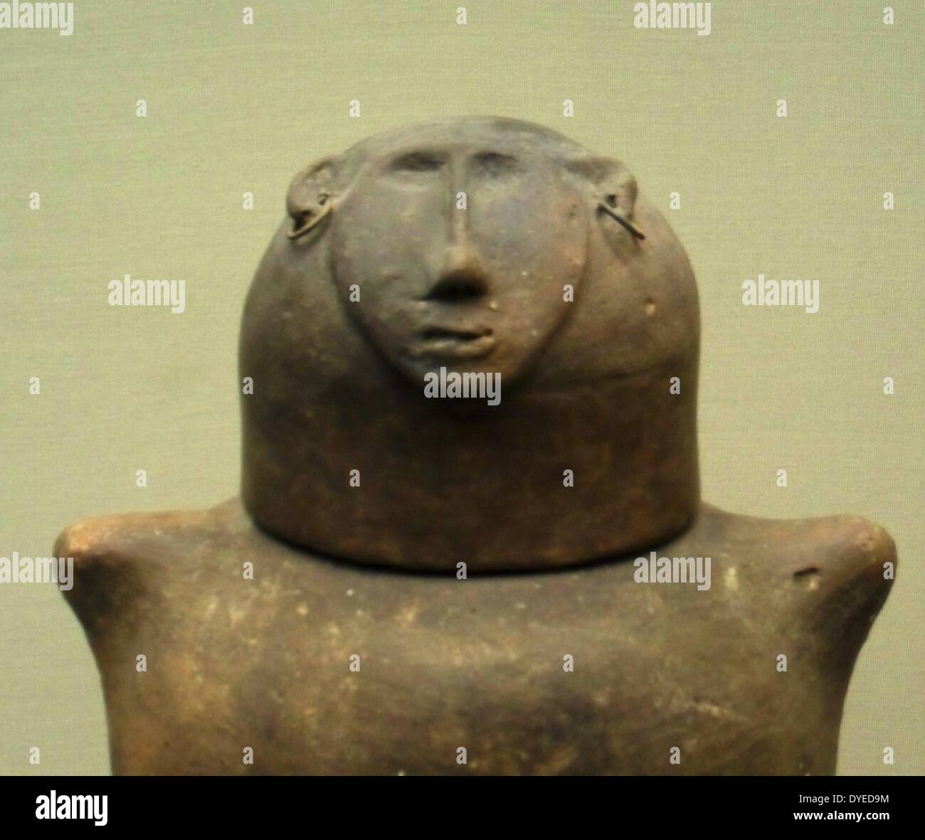 Pottery 8th century. Aurn of a woman with a lid in the form of a face ...